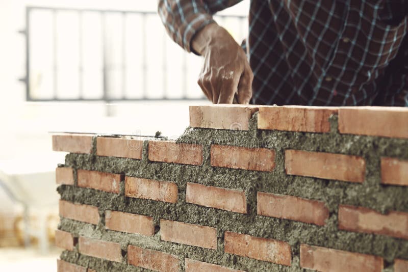 Bricklayer Worker Installing Brick Masonry Stock Photo - Image of ...
