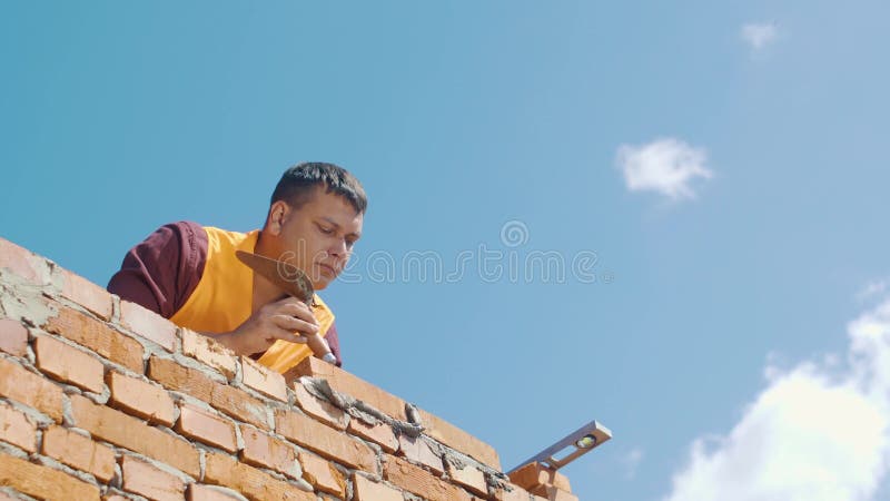 Bricklayer Working on a Blue Sky Background Stock Video - Video of ...