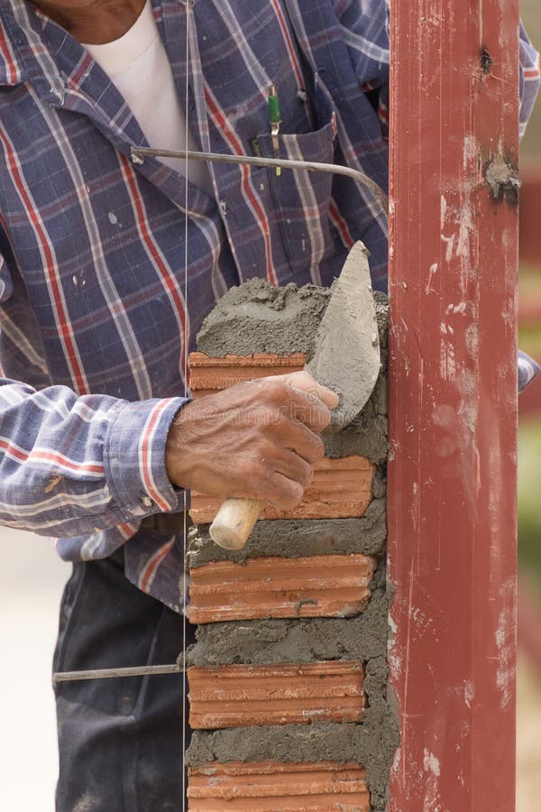 Bricklayer Working in Construction Site of a Brick Wall Stock Photo ...