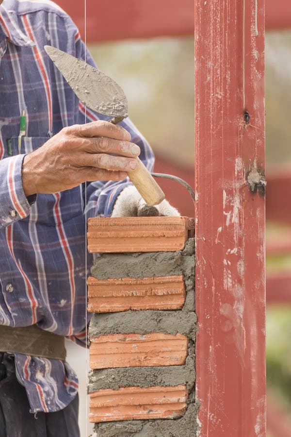 Bricklayer Working in Construction Site of Brick Wall Stock Photo ...