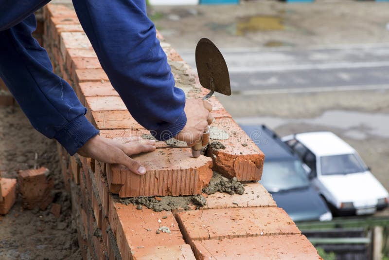 Construction Mason Worker Bricklayer Installing Brick Stock Photo ...