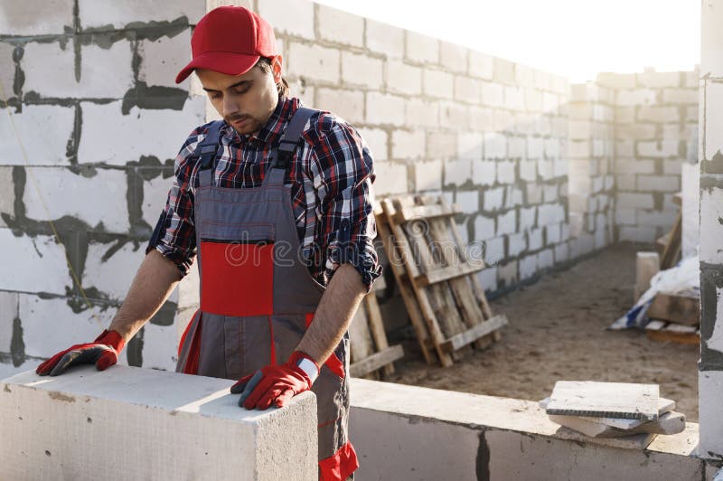 Bricklayer is Working at the Construction Site Stock Photo - Image of ...