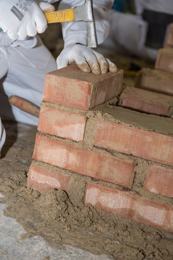 Bricklayer Works with Mason Hammer - Close-up Stock Image - Image of ...