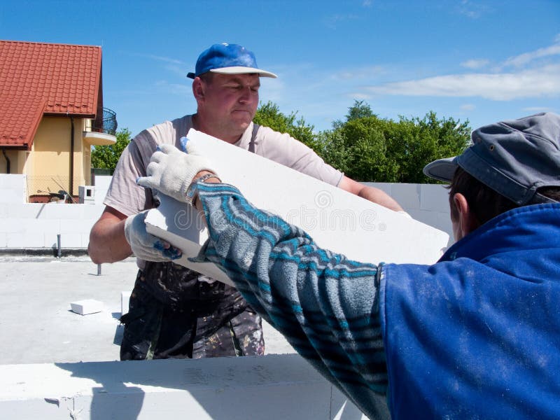 Bricklayers in action stock image. Image of effort, builders - 19685905