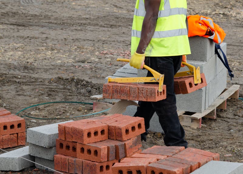 Bricklayers Bringing Bricks Close To His Place of Work Stock Photo ...