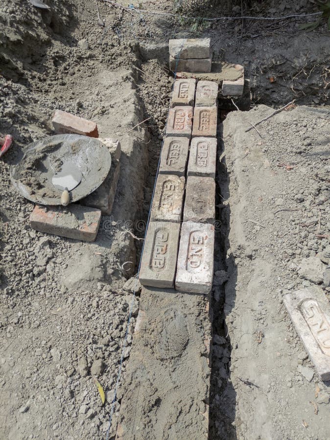 Close Up of Bricklayer Installing Bricks on Construction Site of India ...