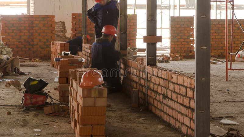 Bricklayers Laying Bricks To Make a Walls Timelapse. Stock Image ...