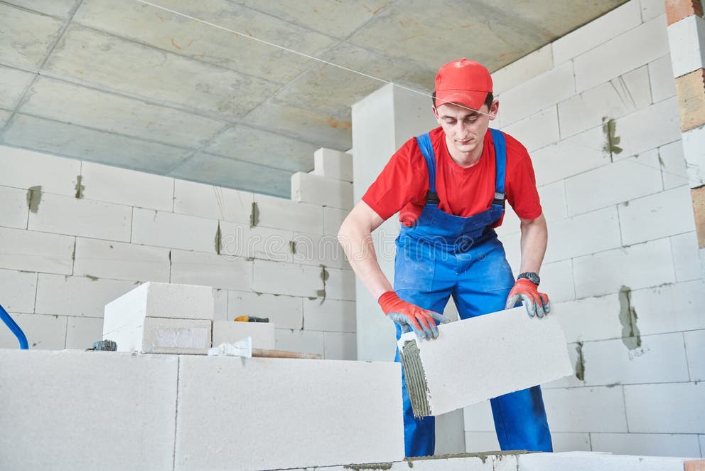 Bricklayer Builder Working with Autoclaved Aerated Concrete Blocks ...