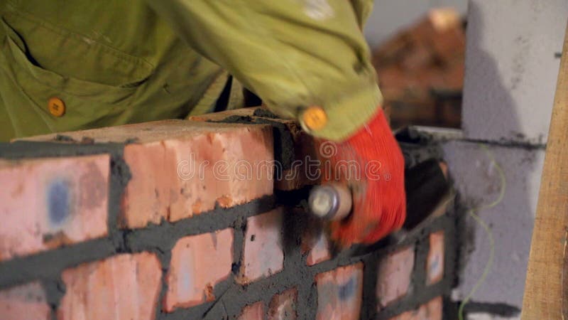 Bricklaying. Hands that Put a Brick on a Construction Site Stock Video ...