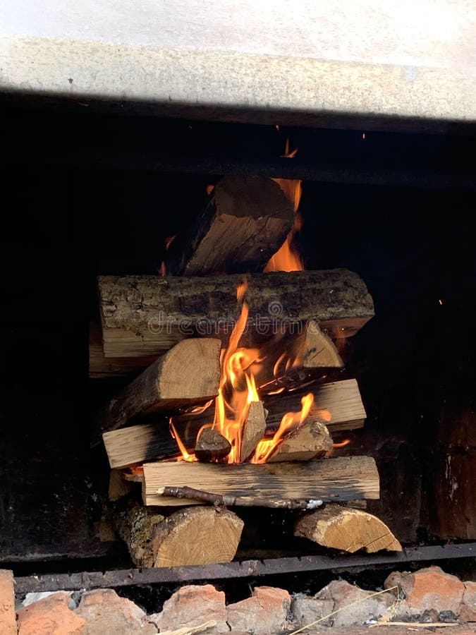 Bricks Campfire with Burning Firewood Stock Photo - Image of light ...