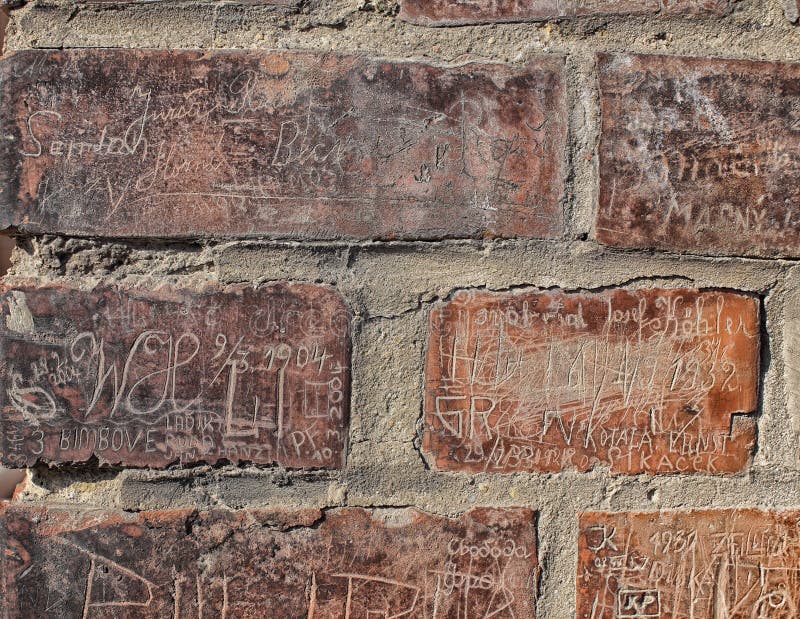 Old Red Wall with Engraved Bricks Stock Photo - Image of date, initials ...