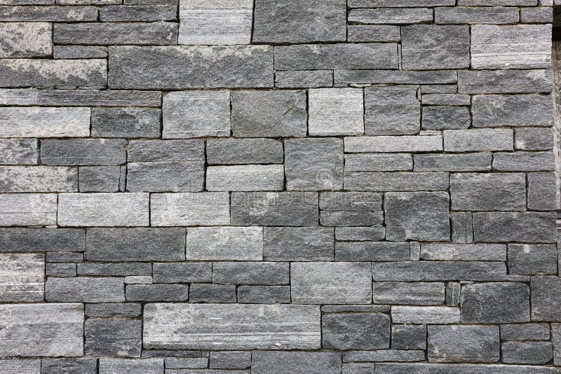 Bricks in a Grey Stone Wall Stock Image - Image of material, stonewall ...