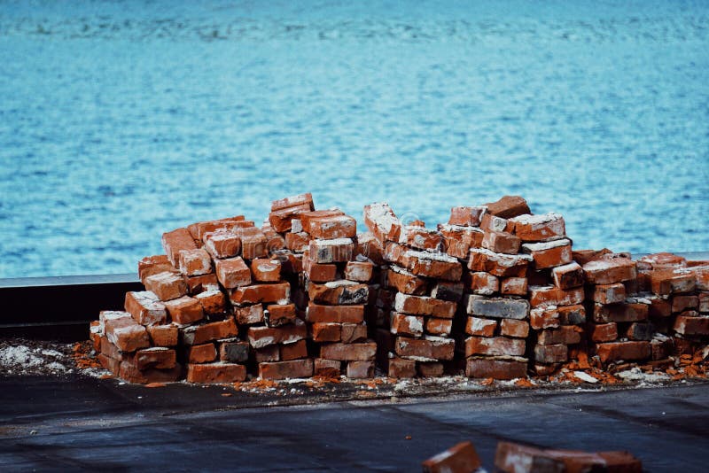 Bricks next to the sea stock image. Image of wave, rock - 249823693