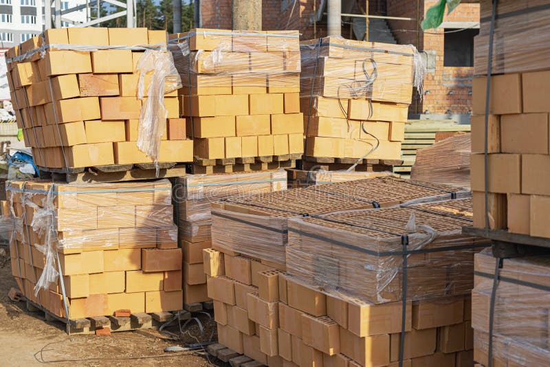Bricks in Pallets on a Construction Site. Construction Materials Stock ...
