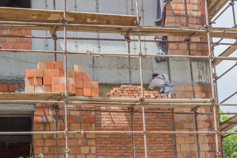 Bricks and scaffolding stock photo. Image of property - 89495168