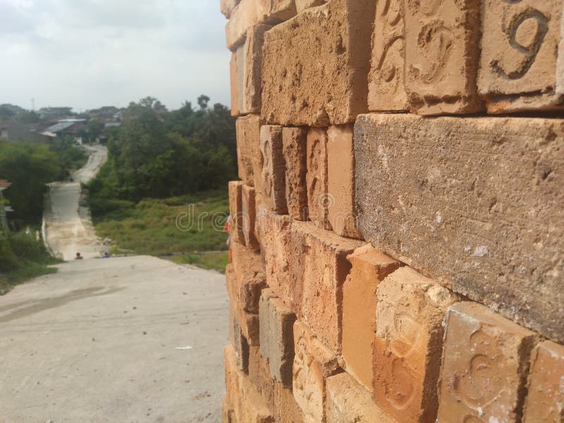 Bricks on the Side of the Road Stock Image - Image of brick, stonewall ...