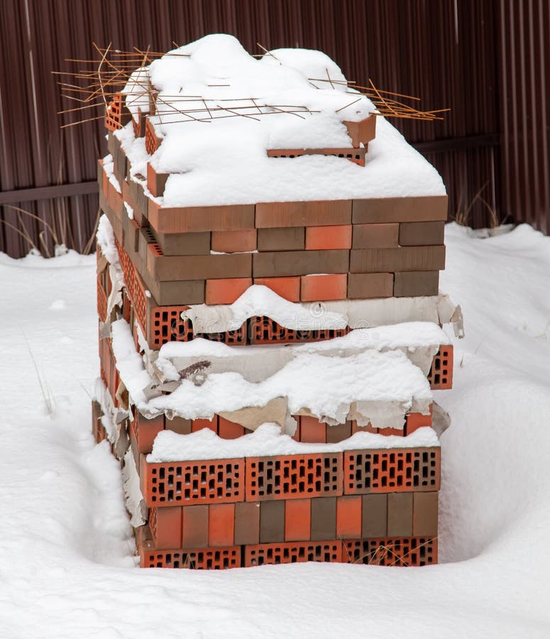 Bricks in the Snow at a Construction Site Stock Photo - Image of ...