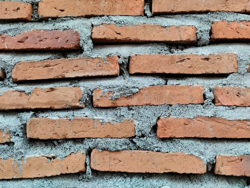 Bricks stacked with cement stock image. Image of soil - 291094525