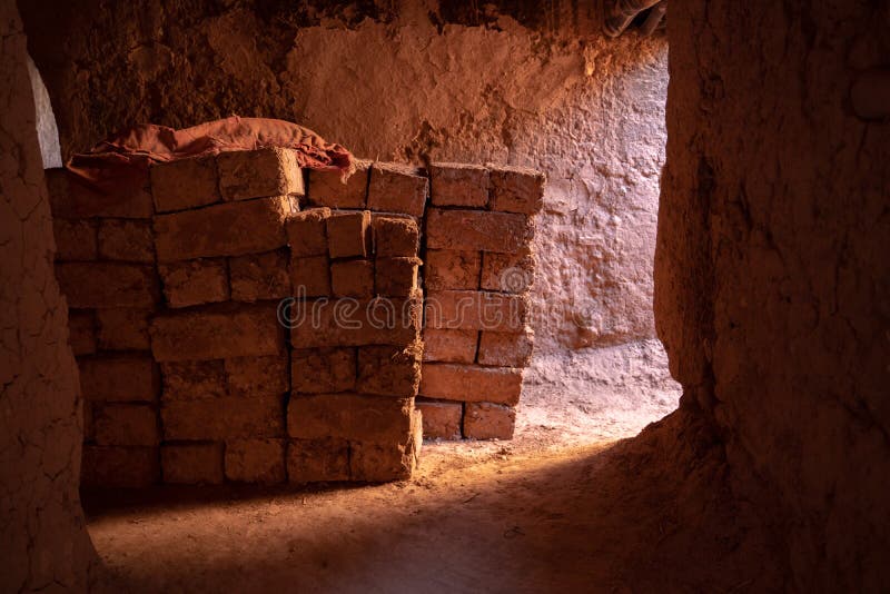 Bricks stacked in old cave stock photo. Image of indoors - 190493338