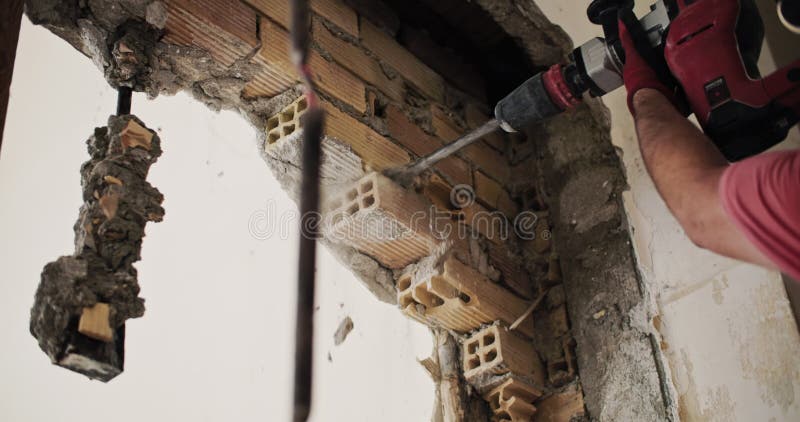 Bricks in the Wall Fall Off from Work by a Builder with a Jackhammer ...