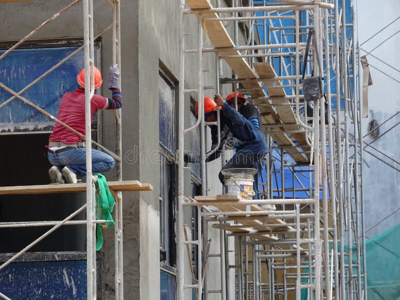 Brickwall Plastered by Construction Workers Using Cement Plaster ...