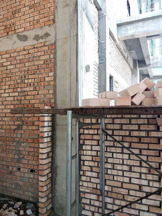Brickwork by Construction Workers at the Construction Site. Editorial ...