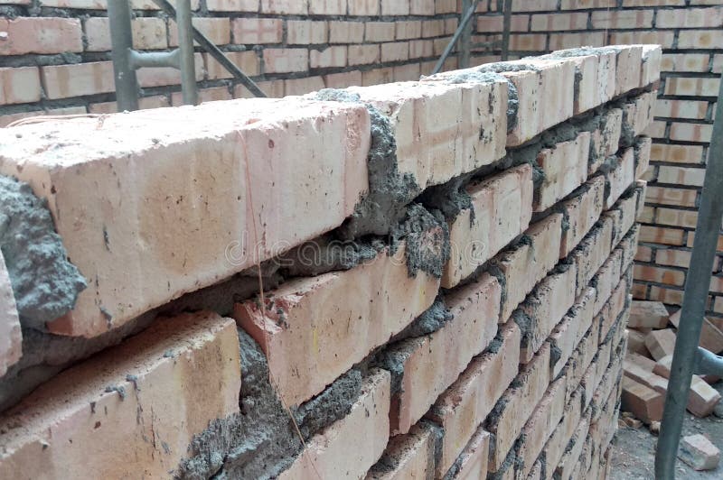 Brickwork by Construction Workers at the Construction Site. Editorial ...