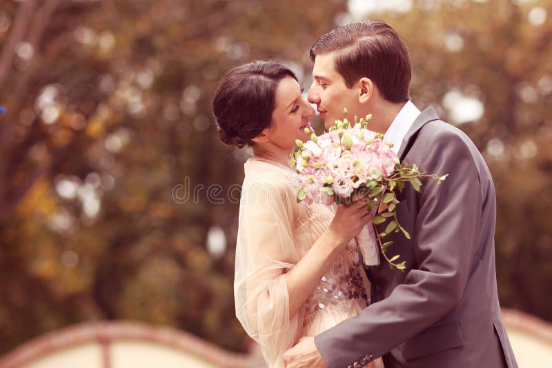 Bridal couple kissing stock photo. Image of bouquet, love - 58056308