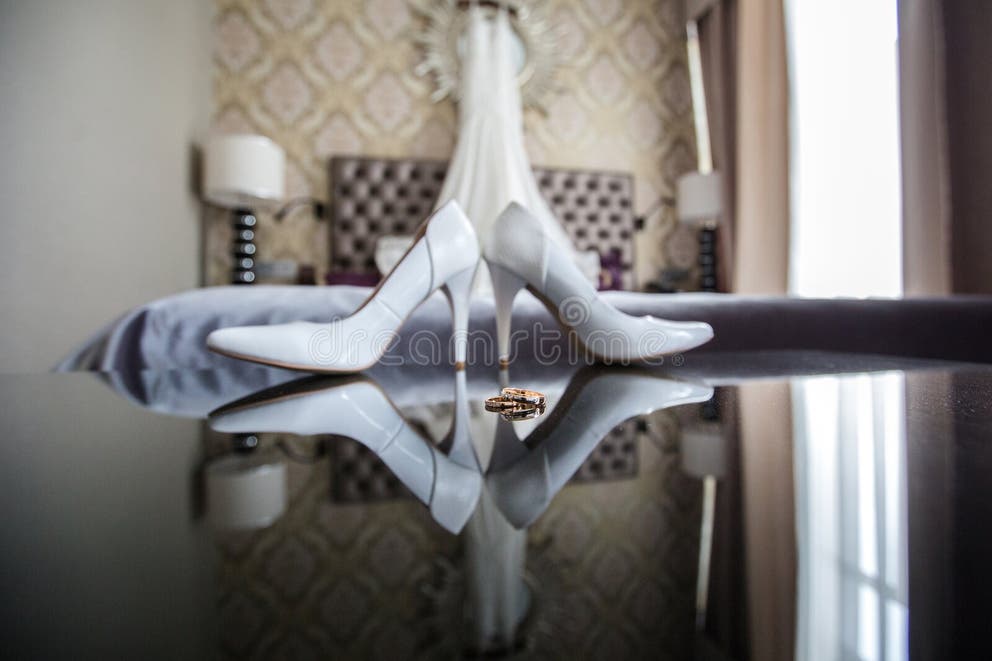 Bridal Elegance: White Heels and Wedding Ring Reflection Stock Image ...