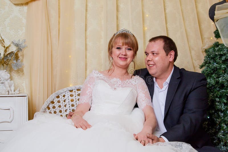 Bride and Big Fat Groom in a Nice Room Stock Photo - Image of hall ...
