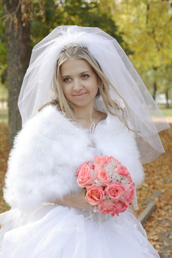 Bride with Bouquet of the Roses Stock Photo - Image of beautiful, eyes ...