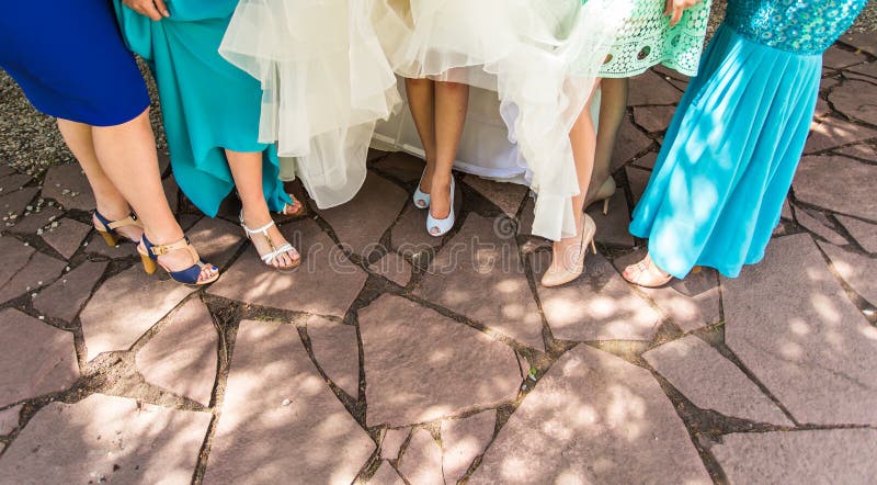 Bride and bridesmaids legs stock photo. Image of bride - 69736344