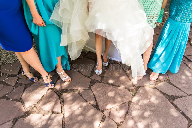 Bride and Bridesmaids Show Off Their Shoes at Wedding. Stock Image ...