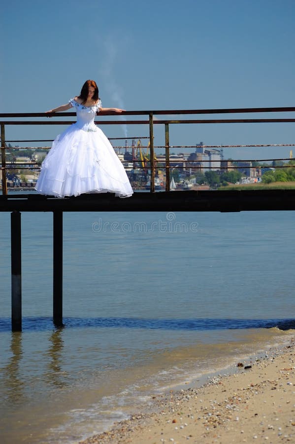 Bride on a bridge stock image. Image of wedding, river - 8182155