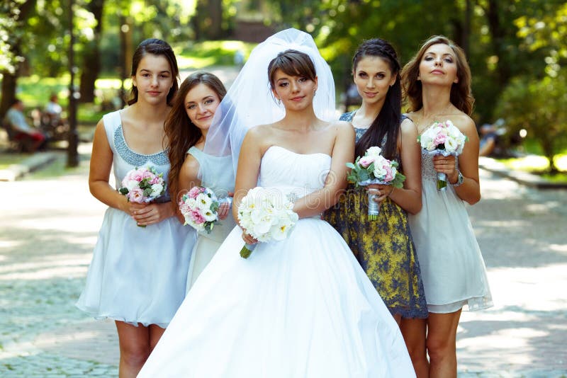 A Look from Afar on a Bride Standing Under a Small Window Stock Photo ...