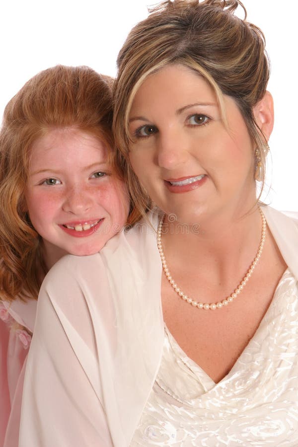 A Bride and Bridesmaid Sharing a Tender Moment on a Wedding Day Stock ...