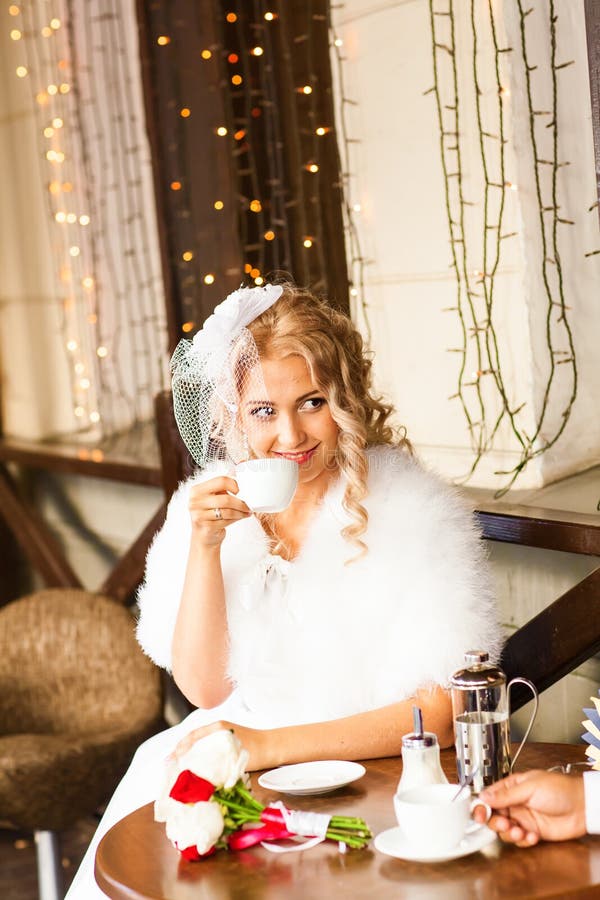 Bride Drinking Coffee at an Outdoor Cafe Stock Image - Image of ...