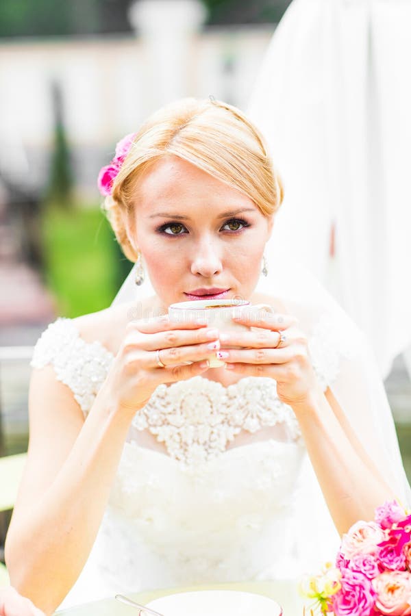 Bride Drinking Coffee at an Outdoor Cafe Stock Photo - Image of ...