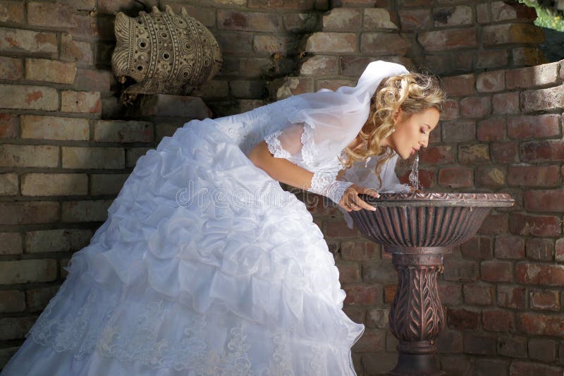 Bride drinking water stock image. Image of fountain, water - 29348805