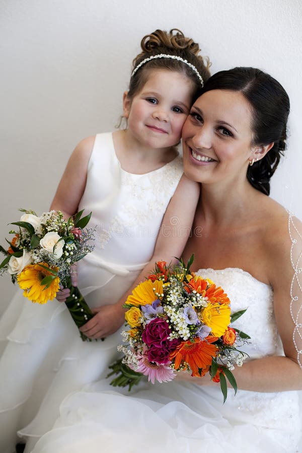 Bride and flower girl stock photo. Image of outdoors - 15238310