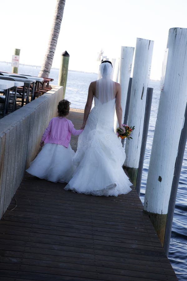 Bride and flower girl stock photo. Image of outdoors - 15238310