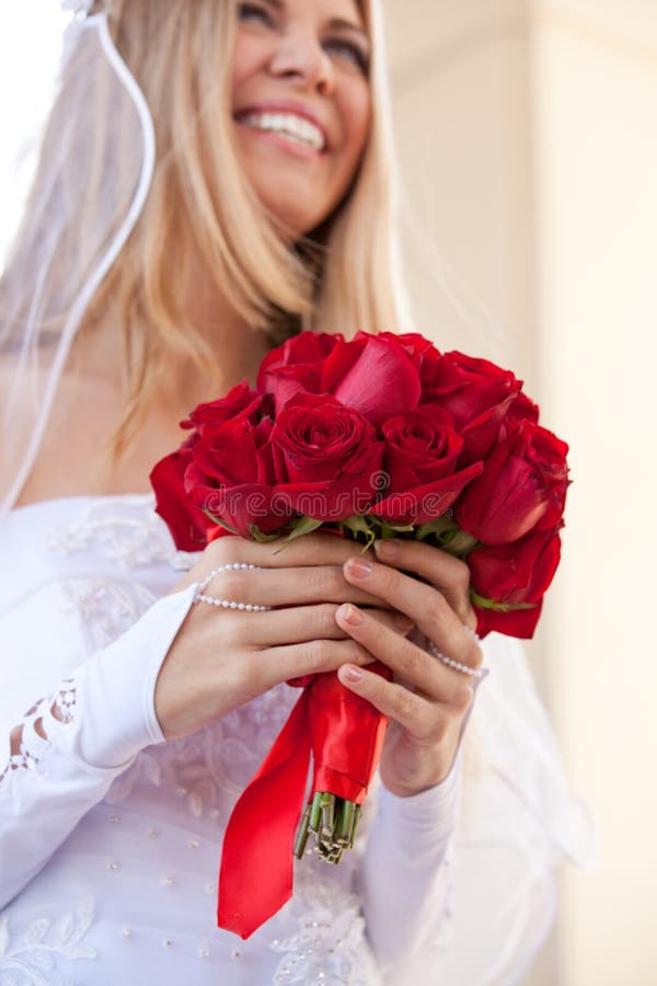 Bride with Focus on Her Red Rose Bouquet Stock Image - Image of love ...