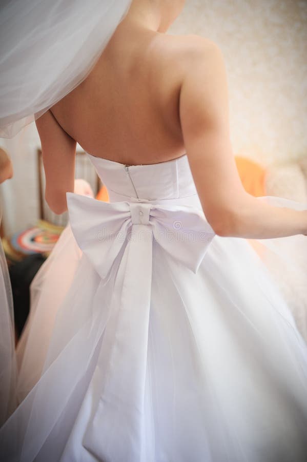 Bride getting dressed stock photo. Image of women, view - 51757334