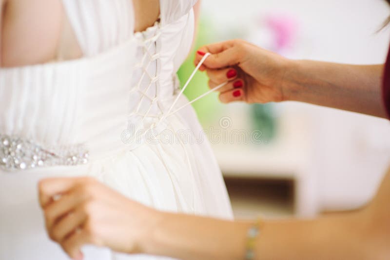 Bride getting dressed stock photo. Image of caucasian - 51757846