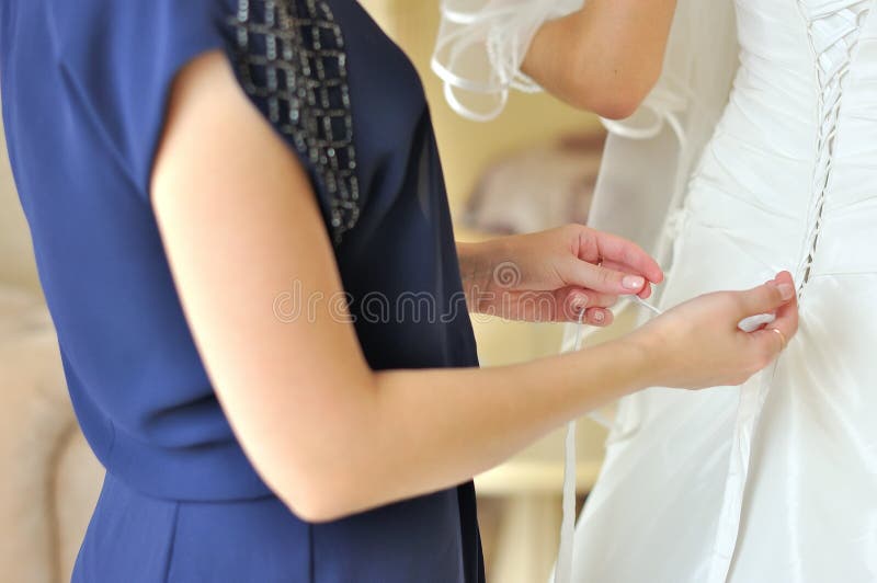 Bride getting dressed stock image. Image of dress, glamour - 97101393