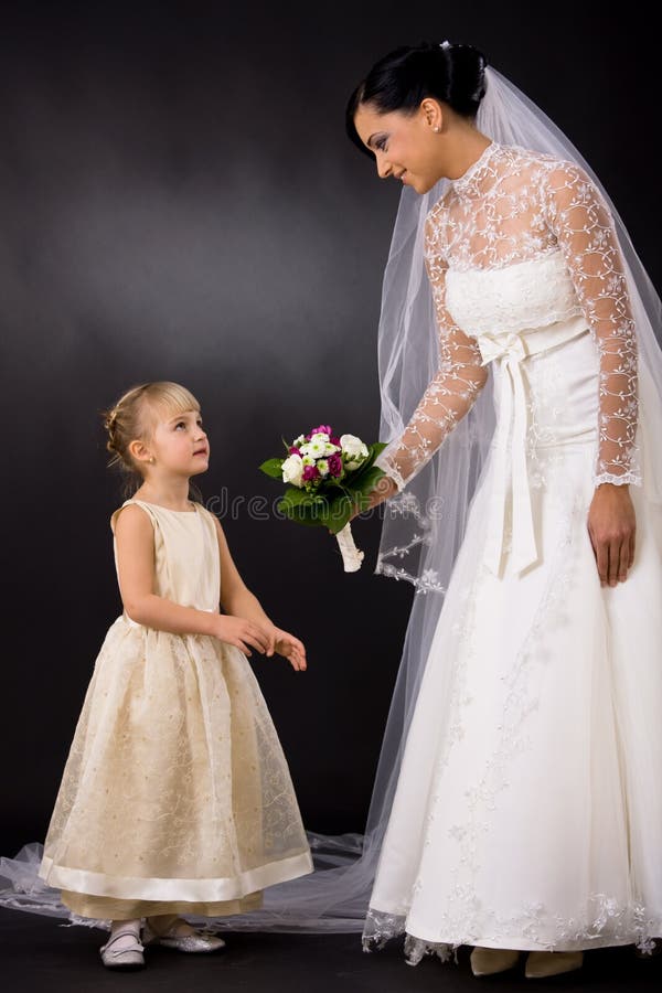 Bride and flower girl stock photo. Image of outdoors - 15238310