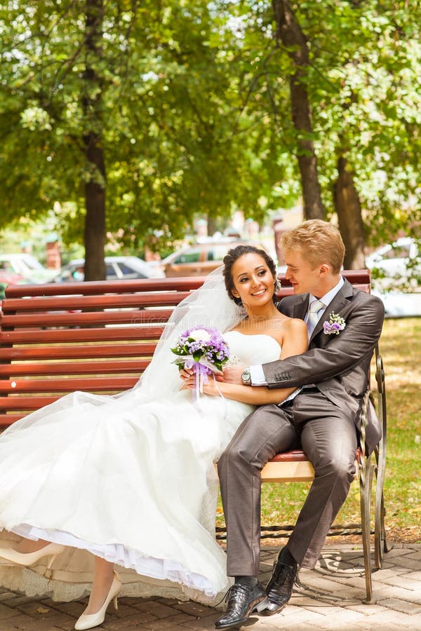Bride and Groom on the Bench Stock Photo - Image of bonding, ring: 64715678