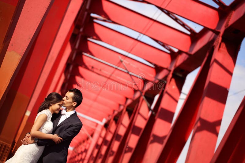 Bride and Groom on a Big Red Bridge Stock Photo - Image of girl, event ...
