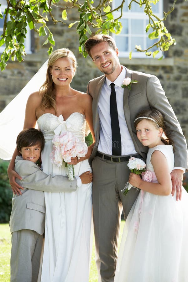 Bride and Groom with Bridesmaid and Page Boy at Wedding Stock Image ...
