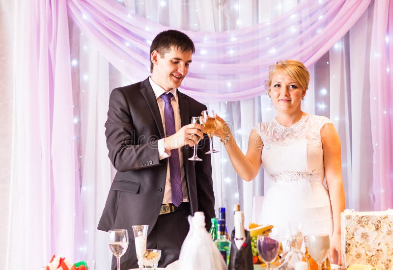 Bride and Groom Celebrating at Reception Stock Image - Image of ...